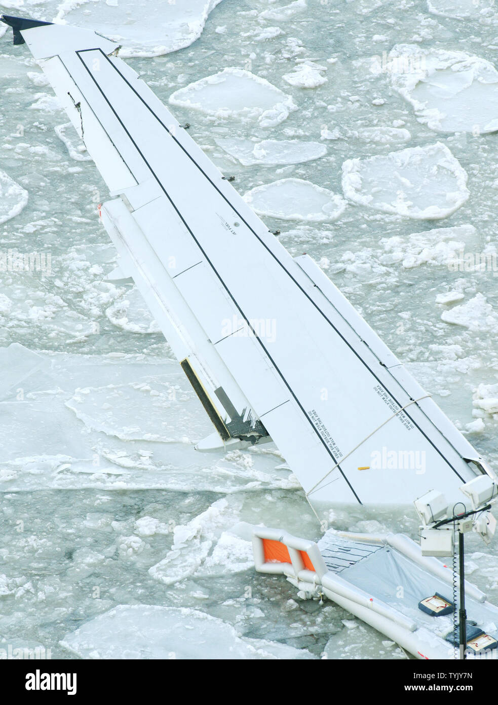 The wing of the US Airways plane is seen in the icy Hudson River, after ...
