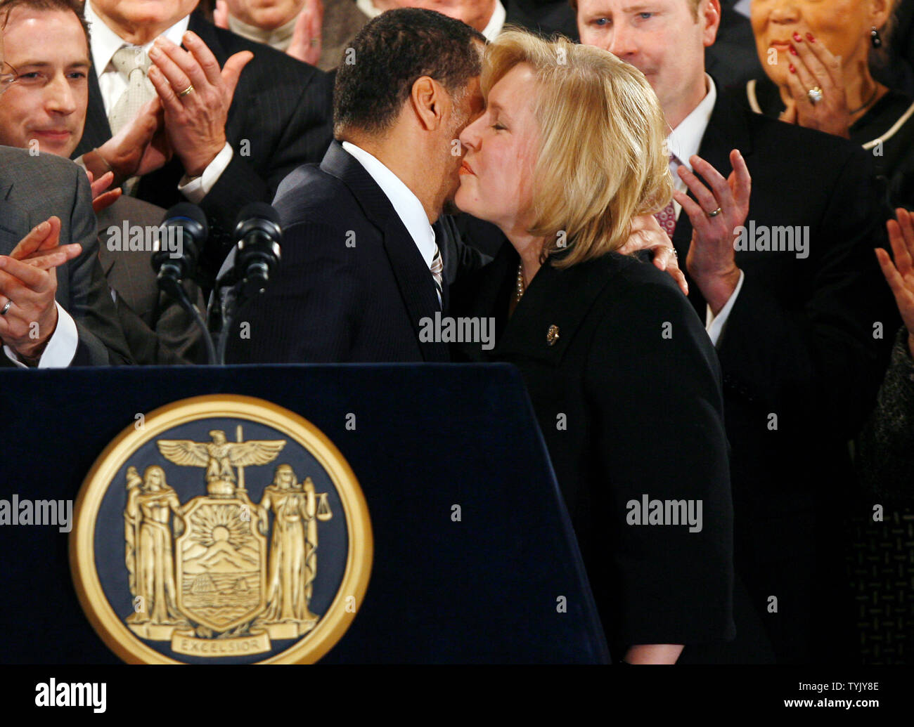 New York Governor David Paterson hugs Kirsten Gillibrand at the podium ...