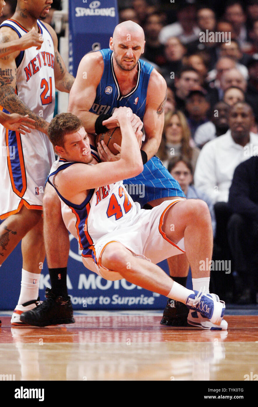 Orlando Magic Marcin Gortat and New York Knicks David Lee (42) fight ...