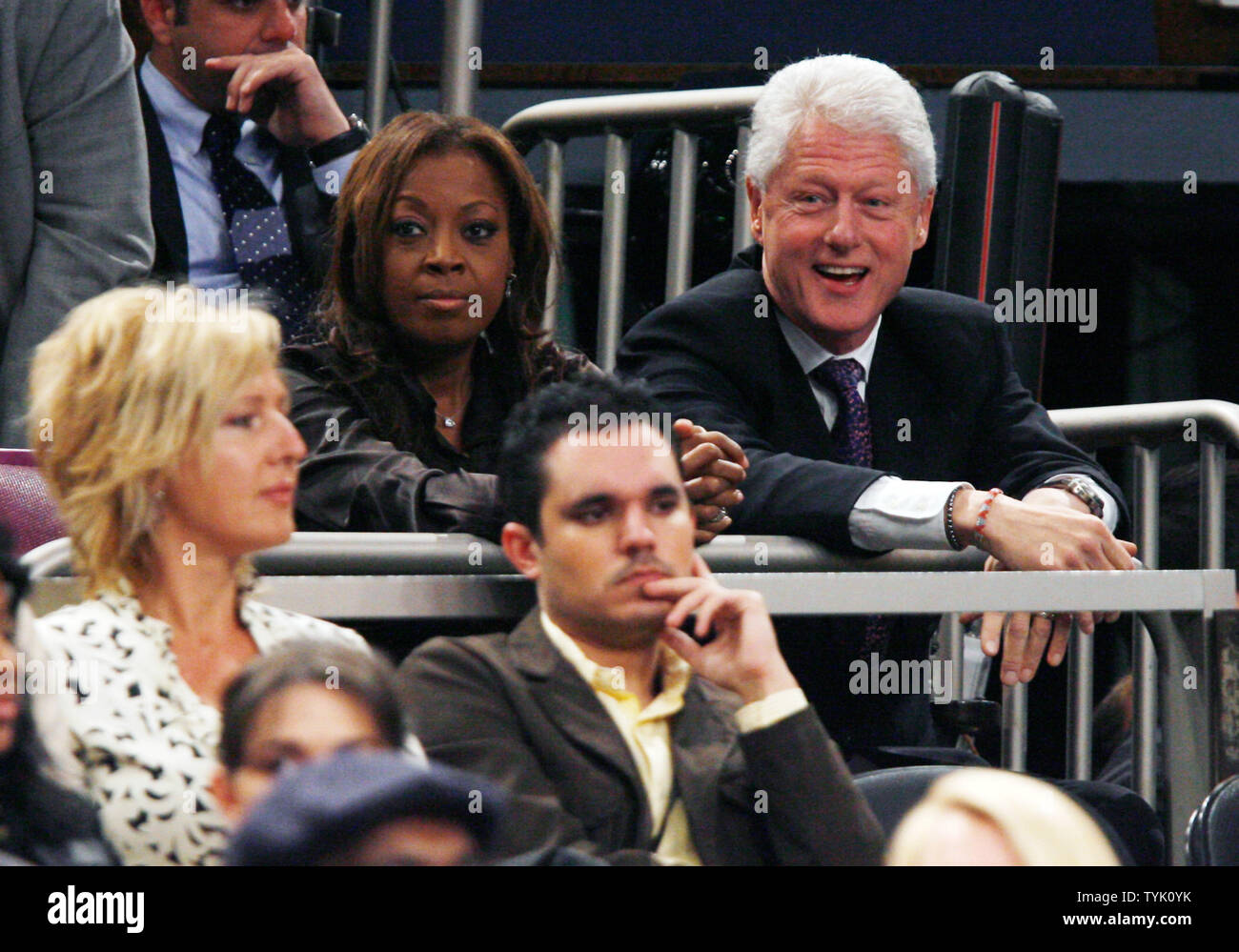 Former president Bill Clinton and Star Jones sit in the crowd before ...