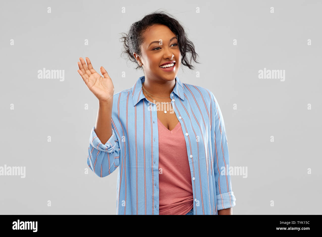 happy african american woman waving hand Stock Photo - Alamy