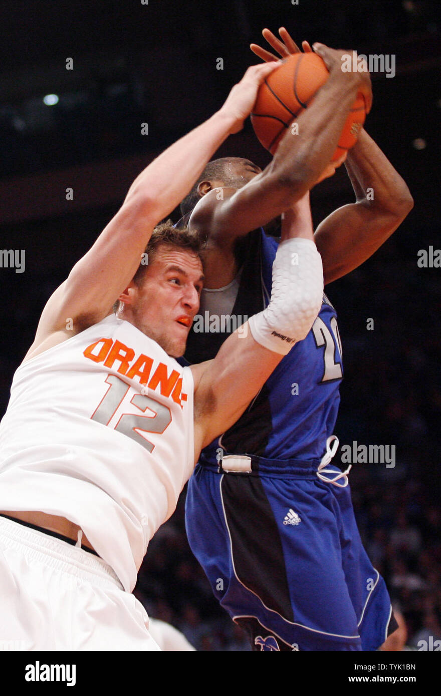 Syracuse Orange Kristof Ongenaet (12) fights for a loose ball with ...
