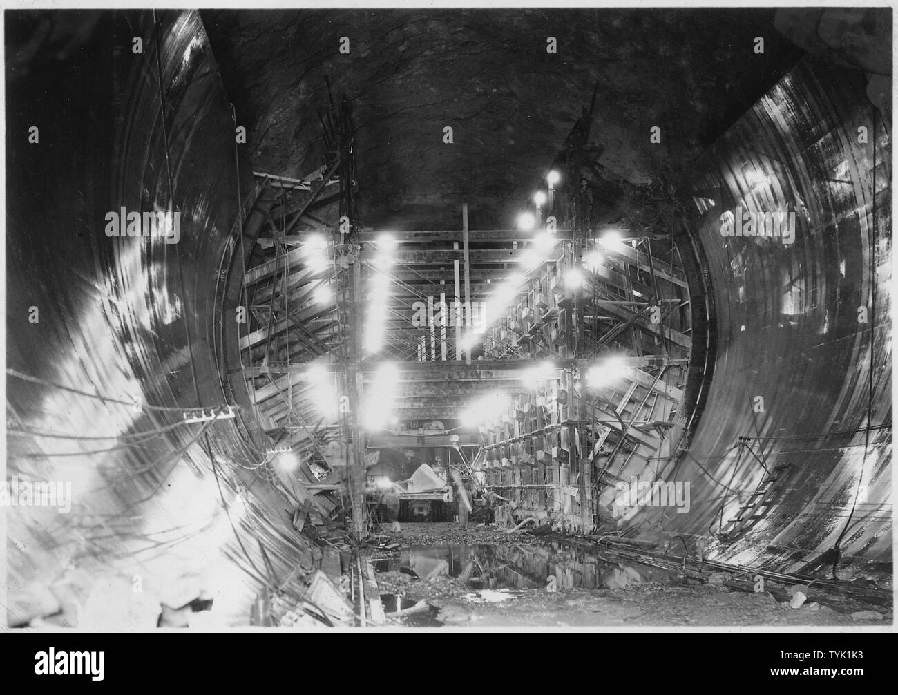 Side-wall concrete forms in place in diversion tunnel No. 2. Truck with ...