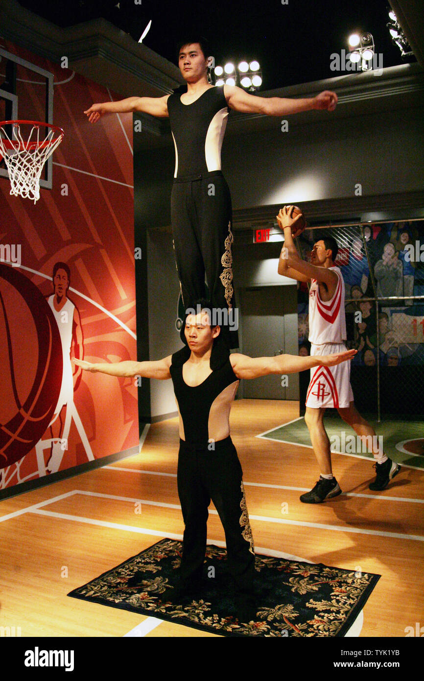 Chinese acrobats perform as Yao Ming wax figure is unveiled at Madame ...