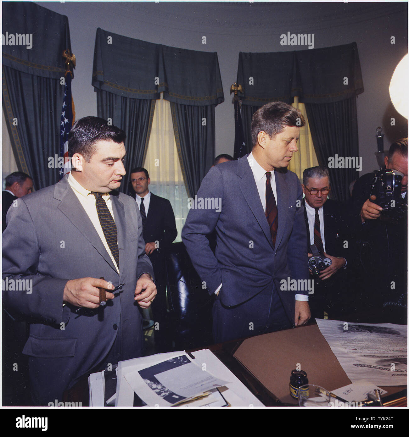 Signing of Commission for General Eisenhower.Press Sec Pierre Salinger ...