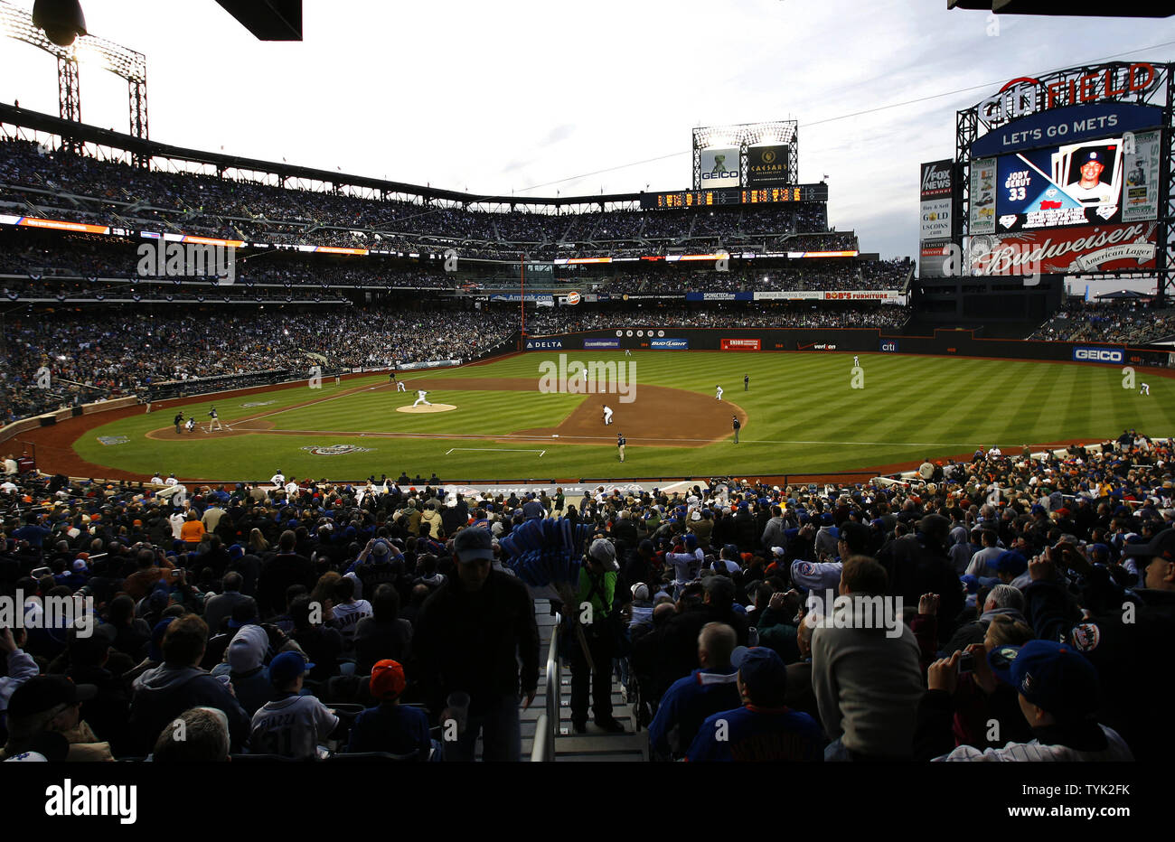 New York Mets starting pitcher Mike Pelfrey throws the first pitch of ...