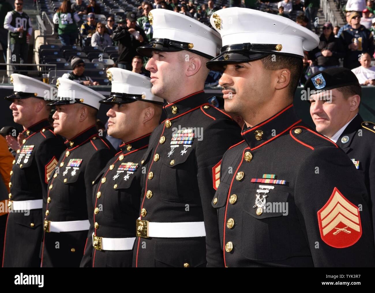 NEW YORK – Members of the Marines line up before walking onto the field ...