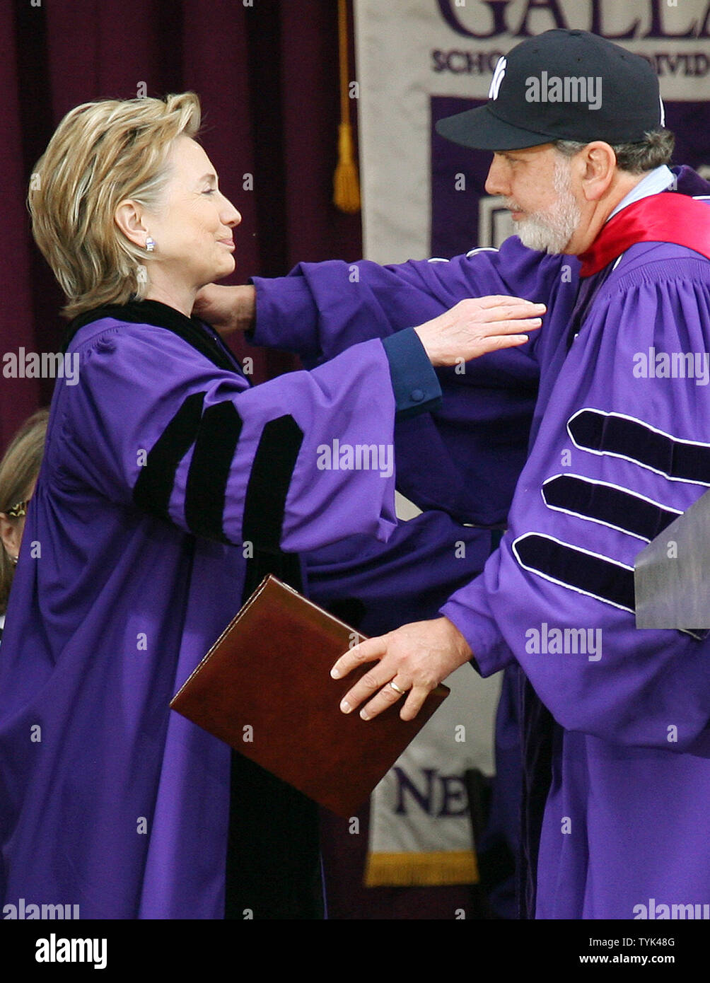 Secretary of State Hillary Rodham Clinton is congratulated by John ...