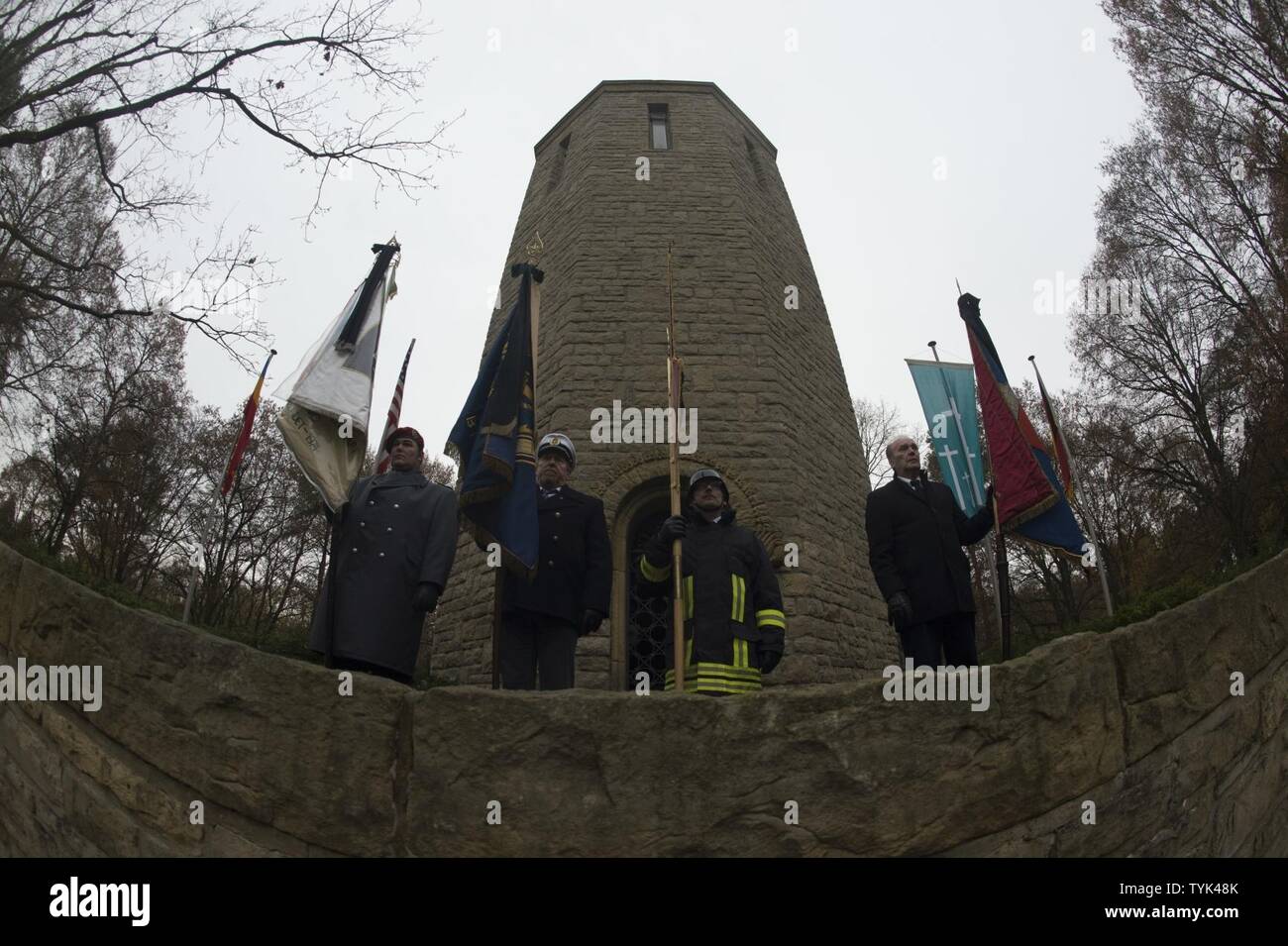 German soldiers and citizens hold up flags during a German National Day ...