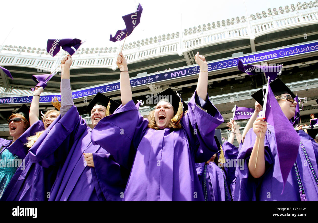 Graduates cheer during New York University's graduation ceremony held ...