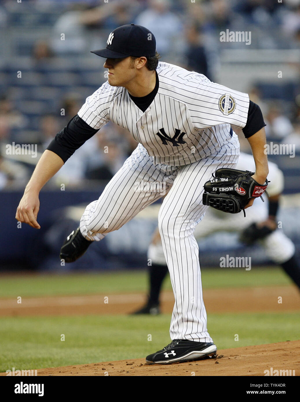 New York Yankees starting pitcher Phil Hughes throws a first inning ...