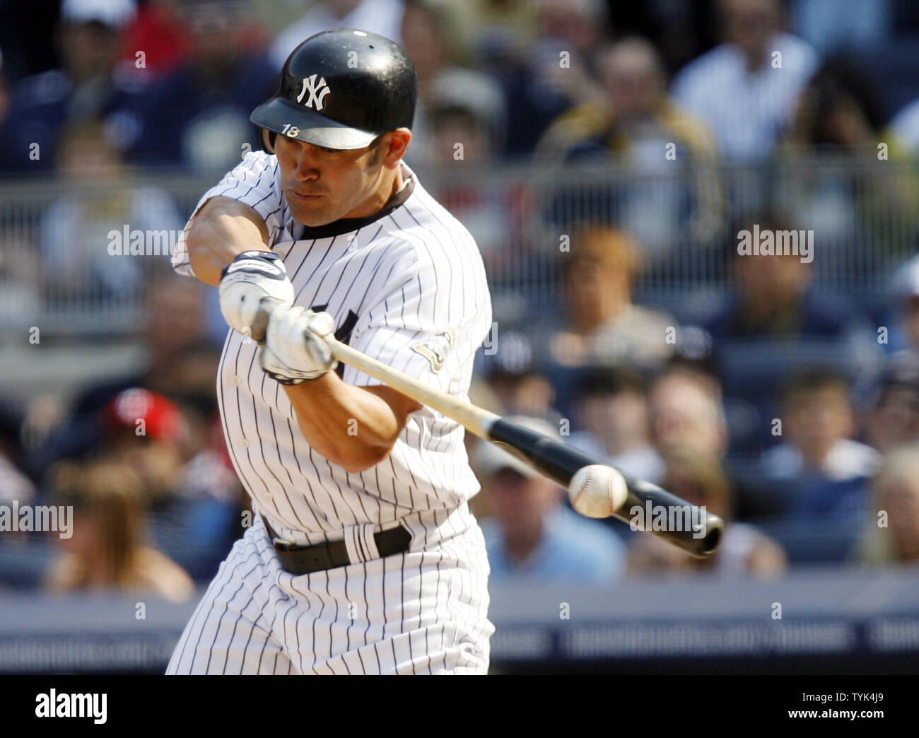 New York Yankees Johnny Damon makes contact with the baseball in the ...