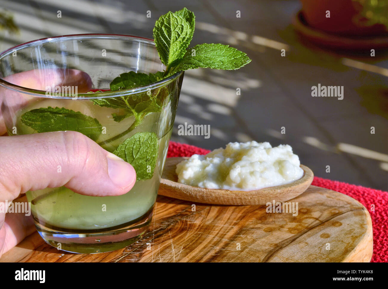 A kefir drink with mint leaves. Probiotic drink without dairy products ...