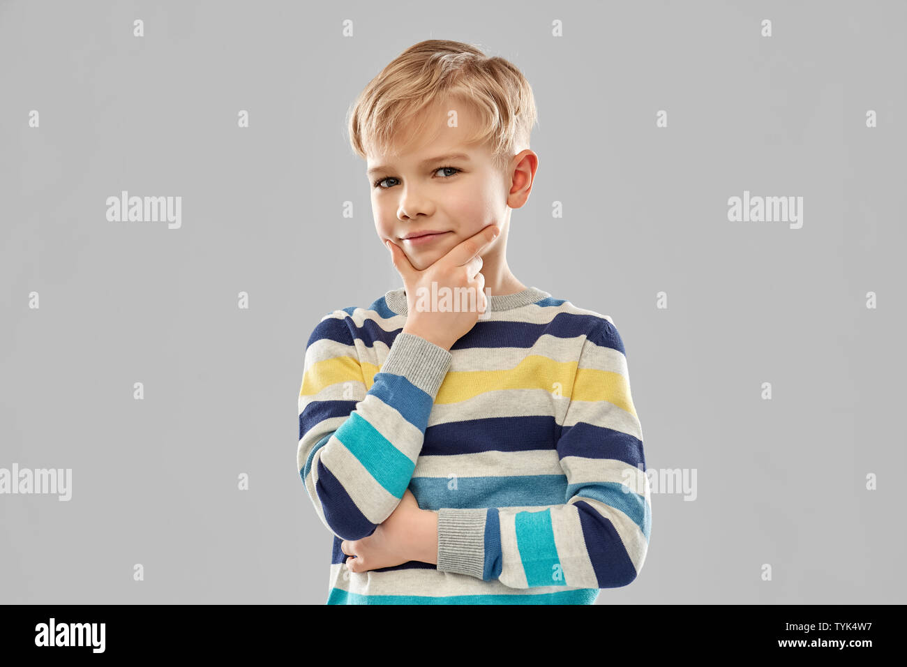 Thinking blonde boy hi-res stock photography and images - Alamy