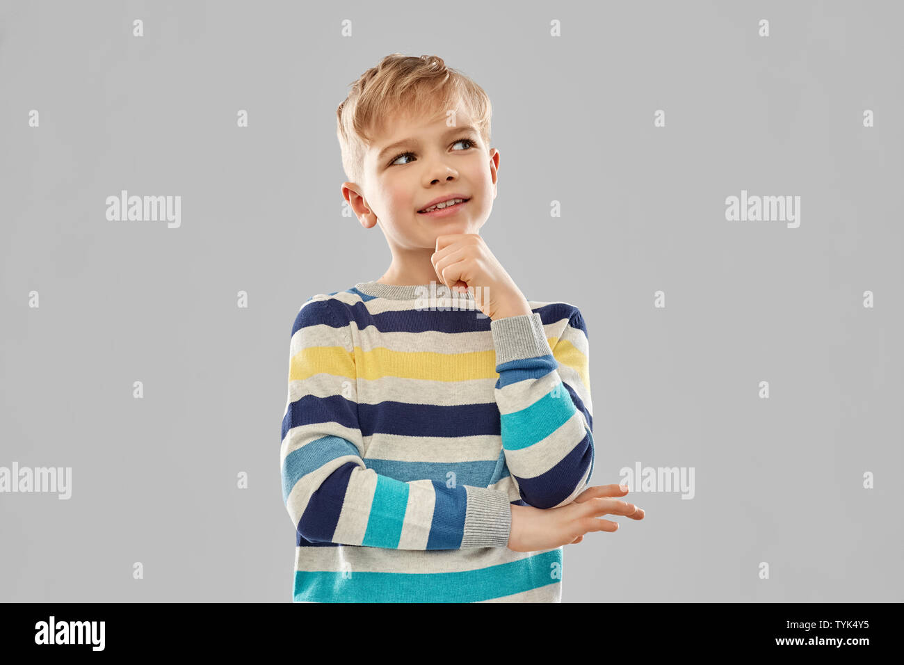Thinking blonde boy hi-res stock photography and images - Alamy