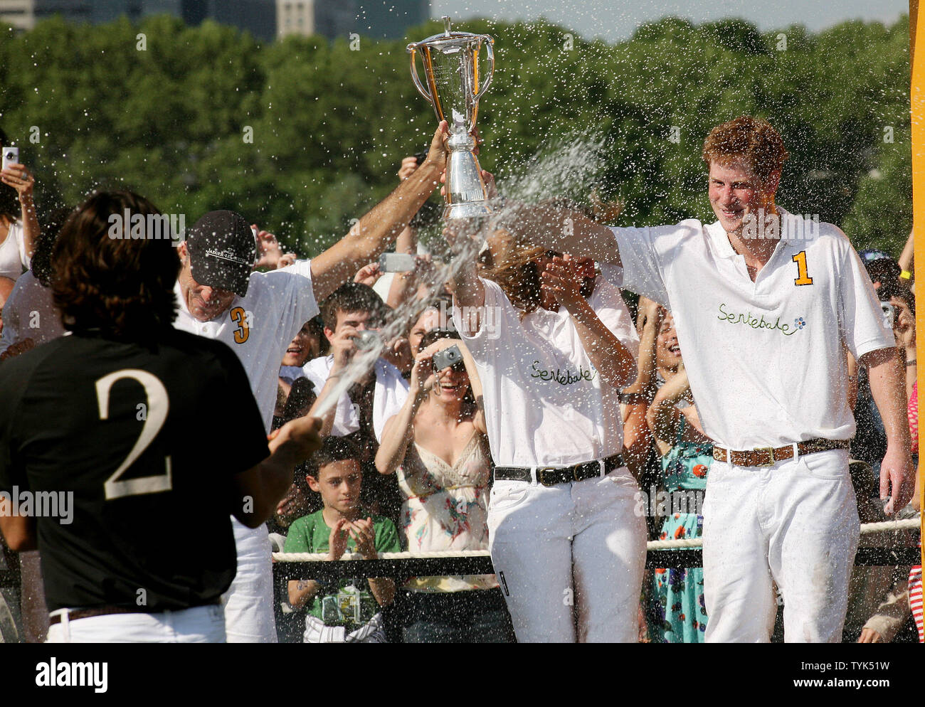 Nacho Figueras (L), world renowned polo player, sprays champagne onto ...