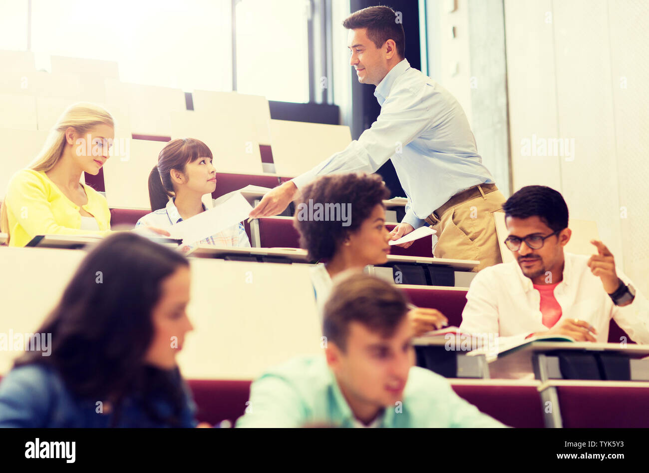 teacher giving test to students on lecture Stock Photo - Alamy