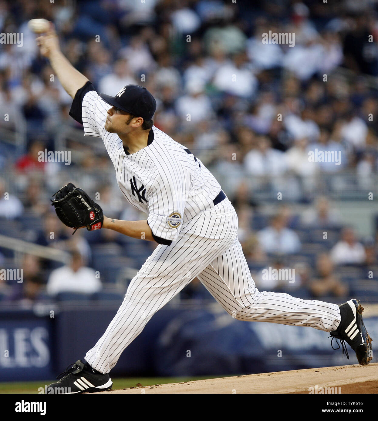 New York Yankees starting pitcher Joba Chamberlain throws a pitch in ...