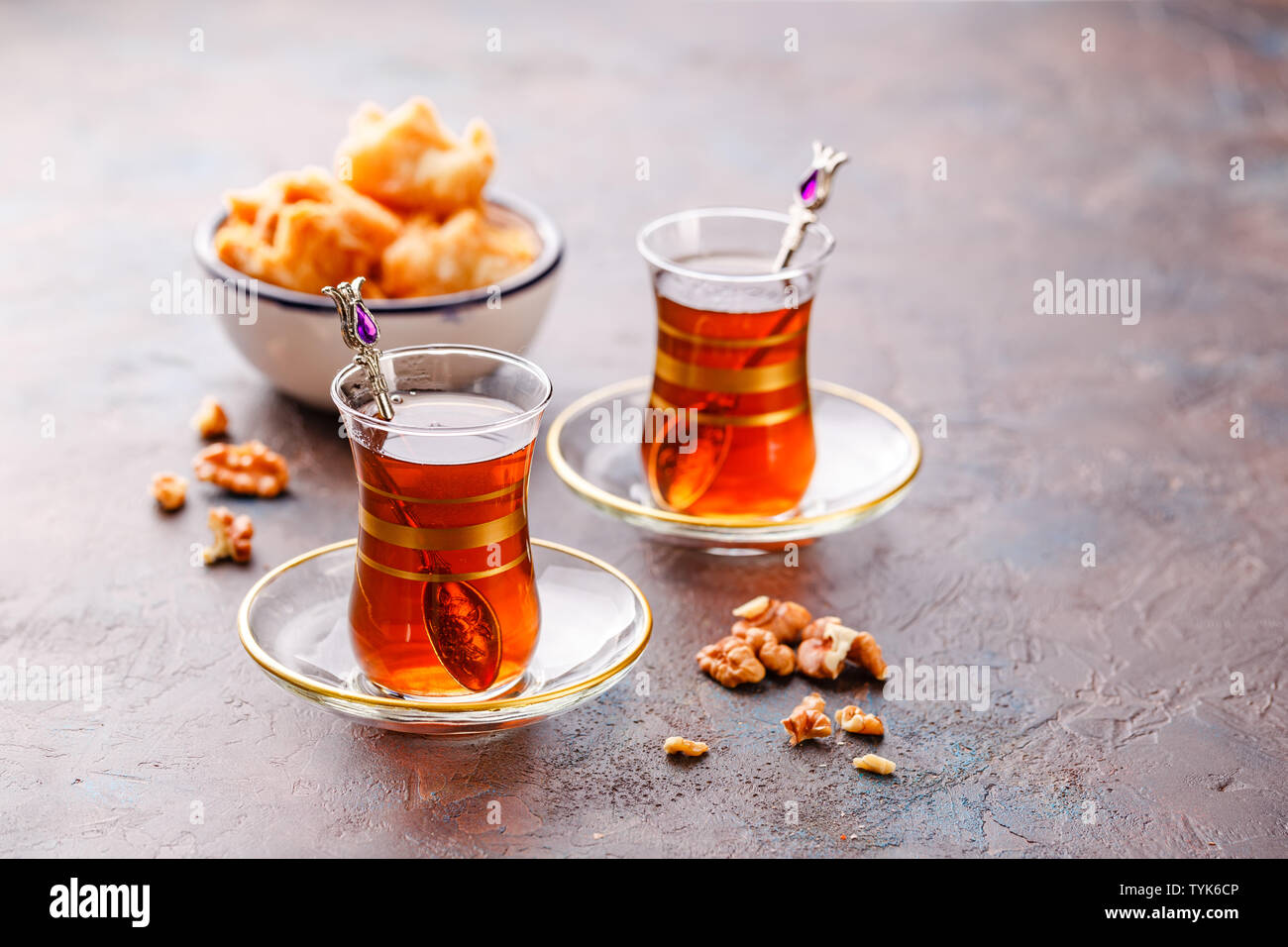 Middle Eastern or Arabic tea with mint in a traditional glass cup and ...