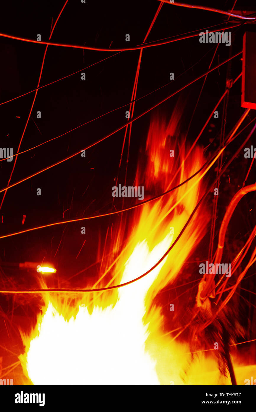 The Night fire in the city. Burnt electrical wires Stock Photo - Alamy