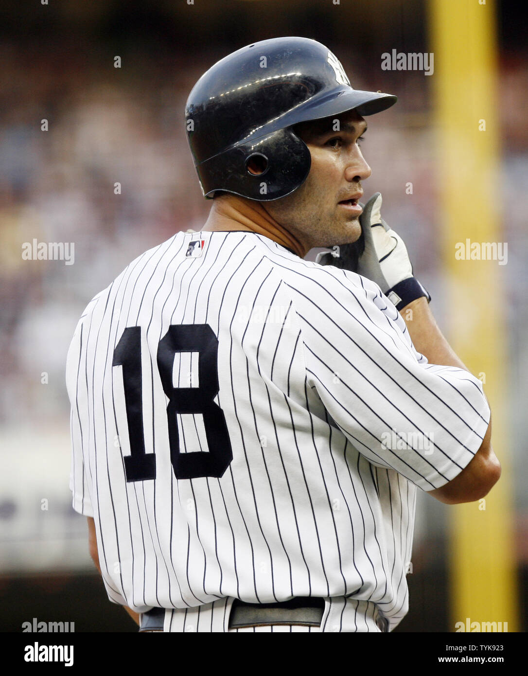 New York Yankees Johnny Damon stands on third base against the ...