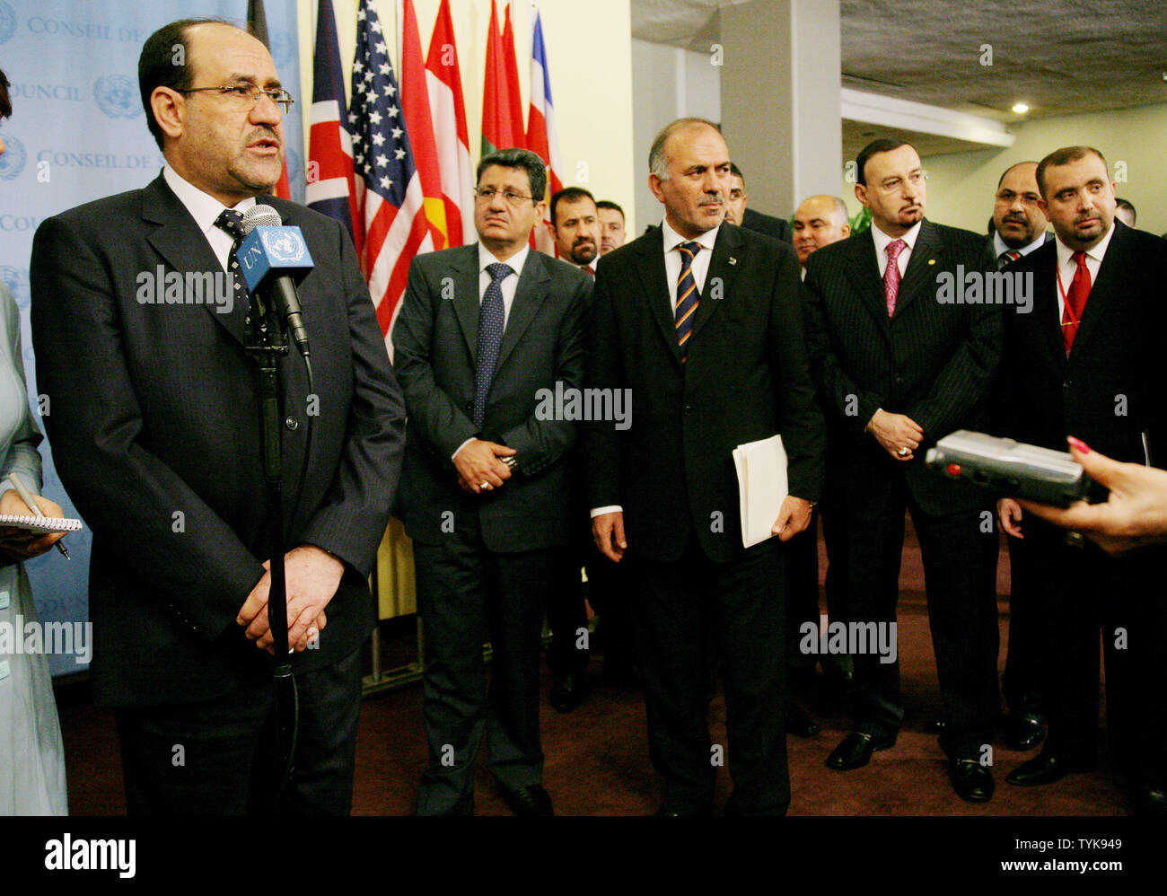 Iraqi's Prime Minister Nouri Kamil al-Maliki (L) talks to the press ...