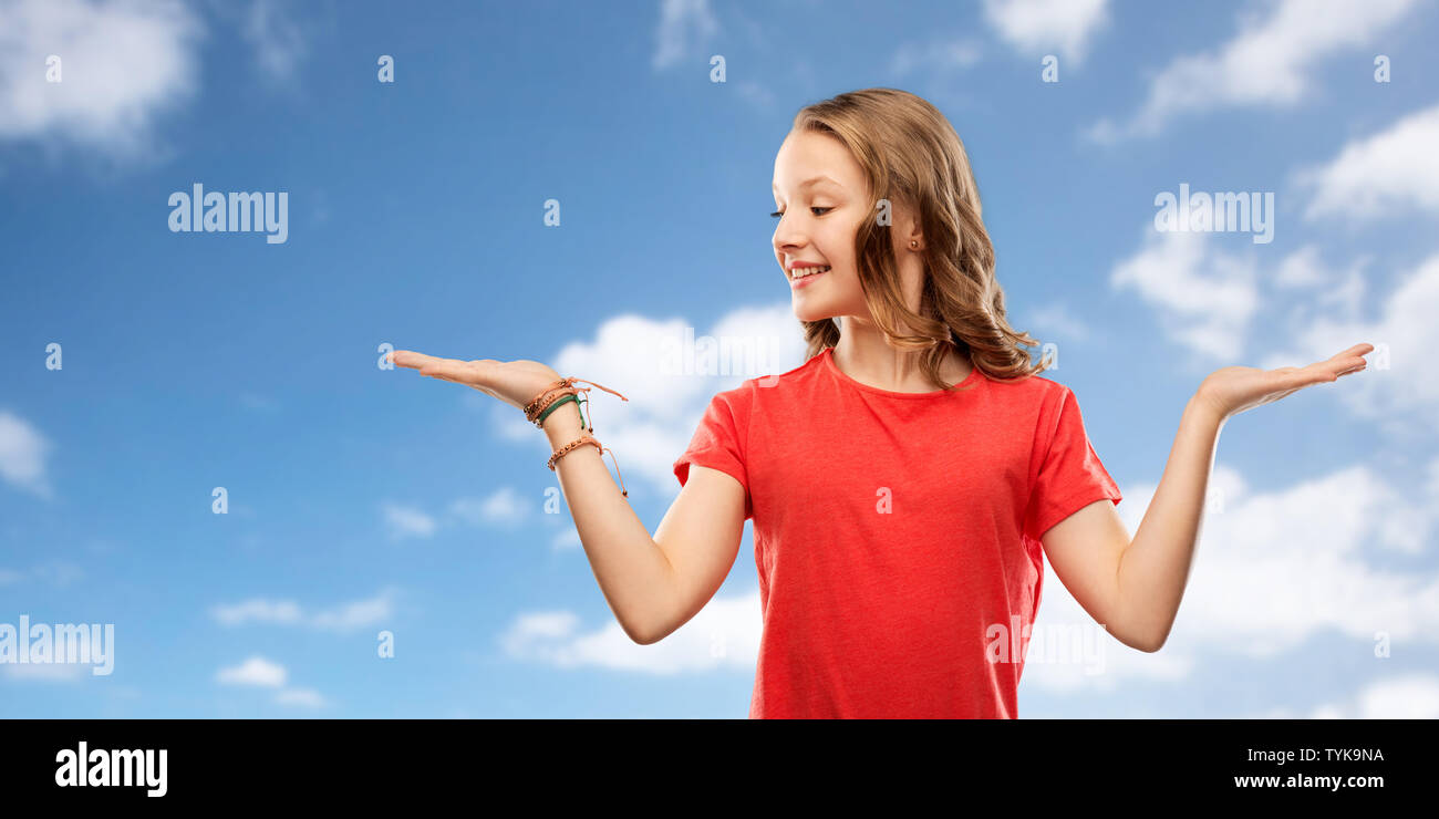 smiling teenage girl holding empty hand Stock Photo - Alamy