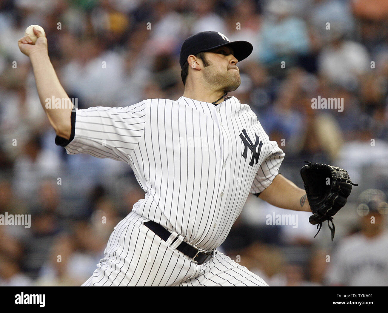 New York Yankees starting pitcher Joba Chamberlain throws a first ...