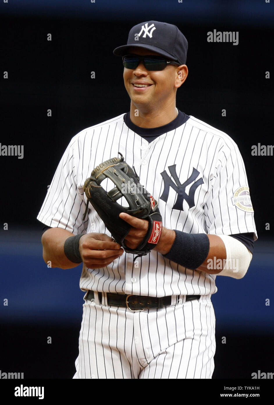 New York Yankees Alex Rodriguez smiles in the first inning against the ...