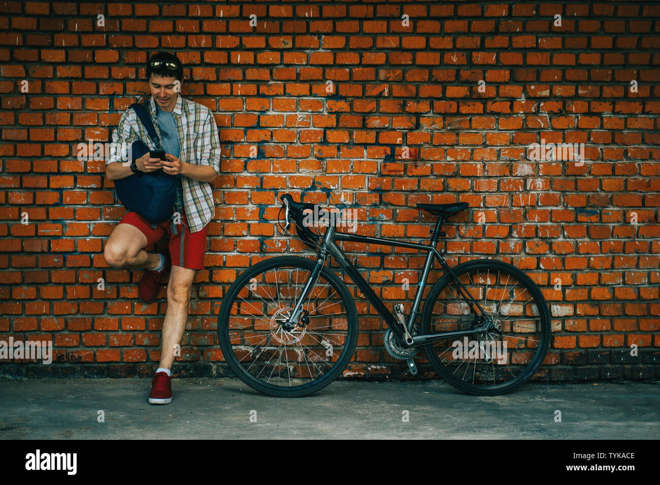 Man posing next bike hi-res stock photography and images - Alamy