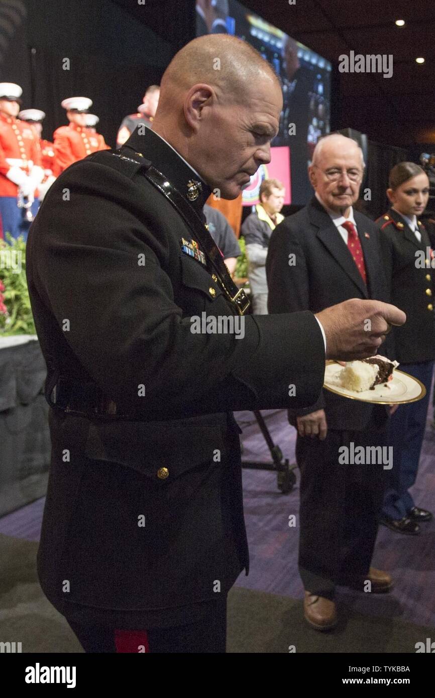 Commandant of the Marine Corps Gen. Robert B. Neller eats a slice of ...