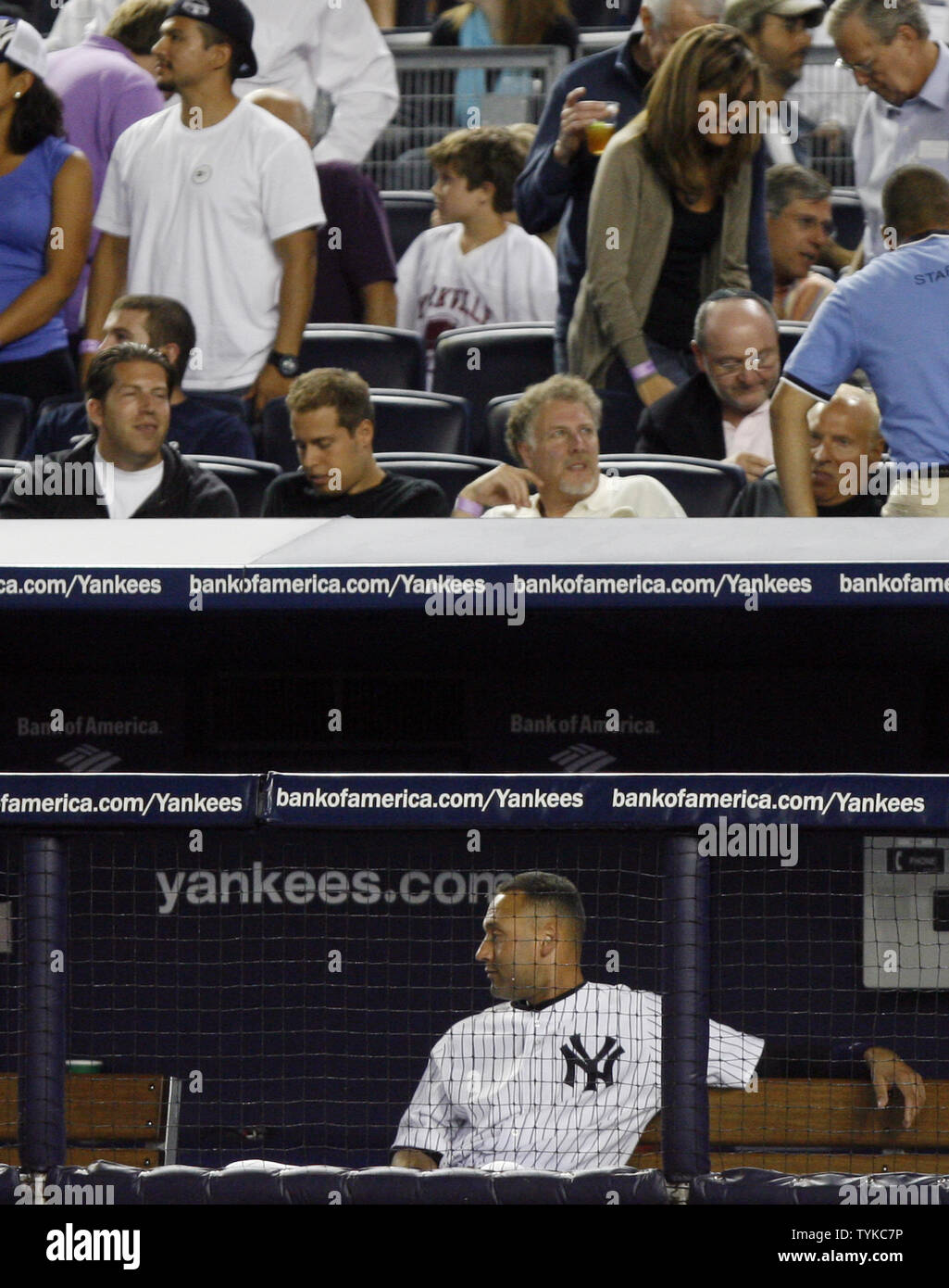 New York Yankees Derek Jeter sits in the dugout after striking out for ...
