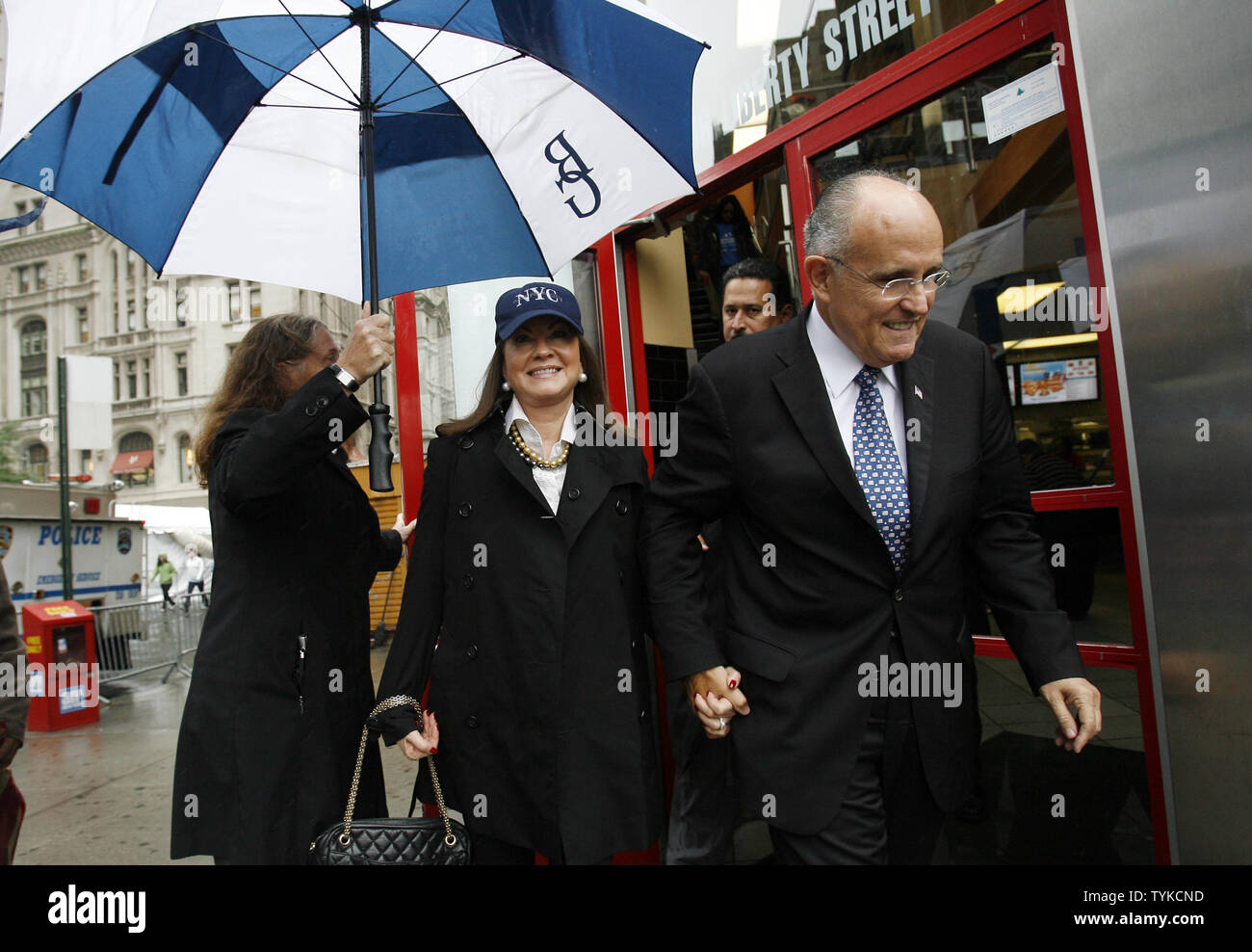 Rudi and Judith Giuliani walk out of a Burger King near Ground Zero ...
