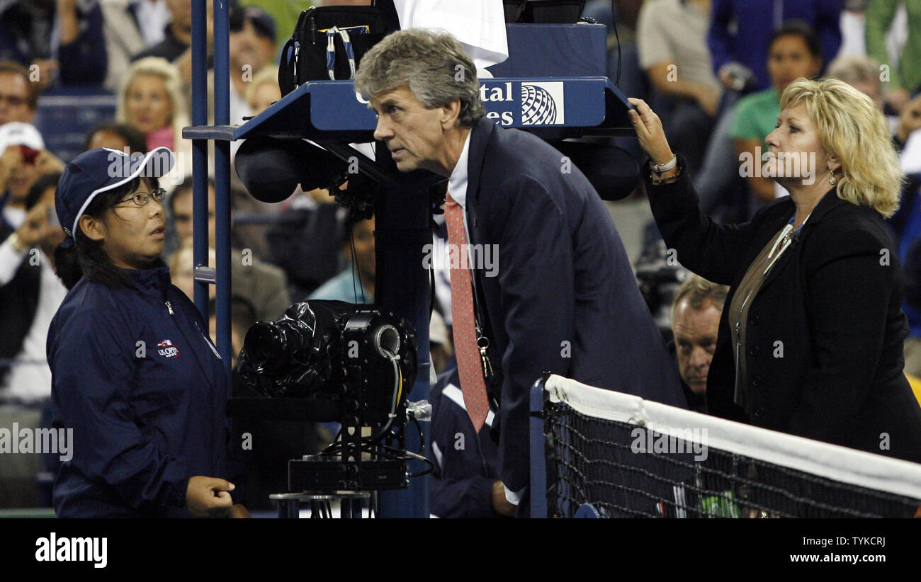 Donna Kelso, Tournament Director Brian Earley, and a line judge talk ...