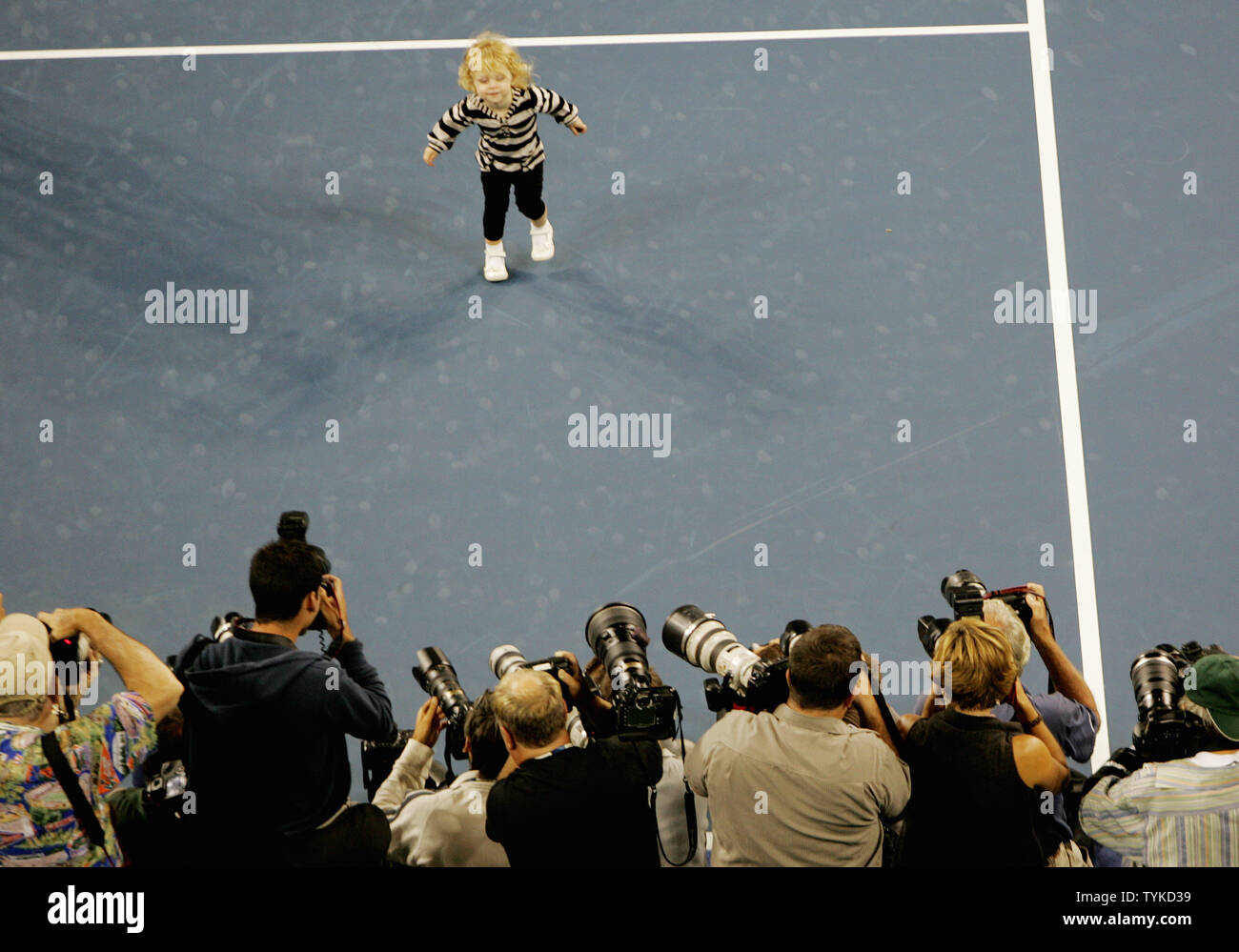 Kim Clijsters' s daughter Jada poses for photographers during the award ...