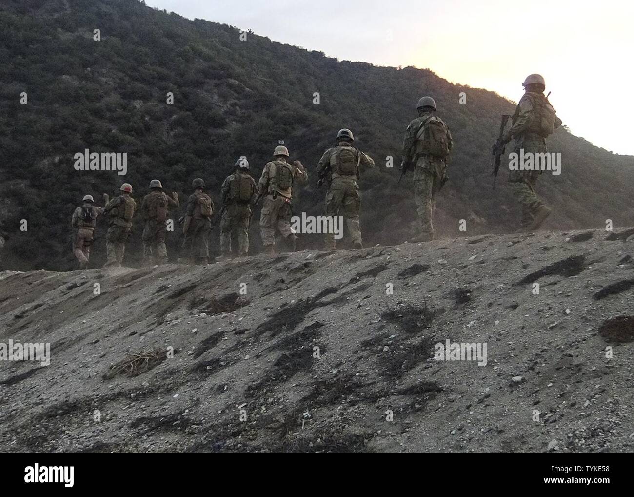U.S. and Canadian service members practice a hasty ambush drill during ...