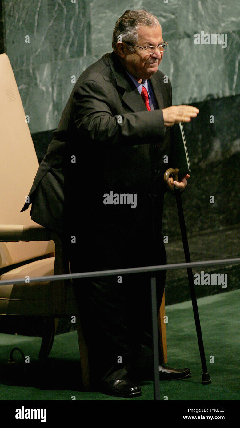Iraq President Jalal Talabani waves to the audience as he is introduced ...
