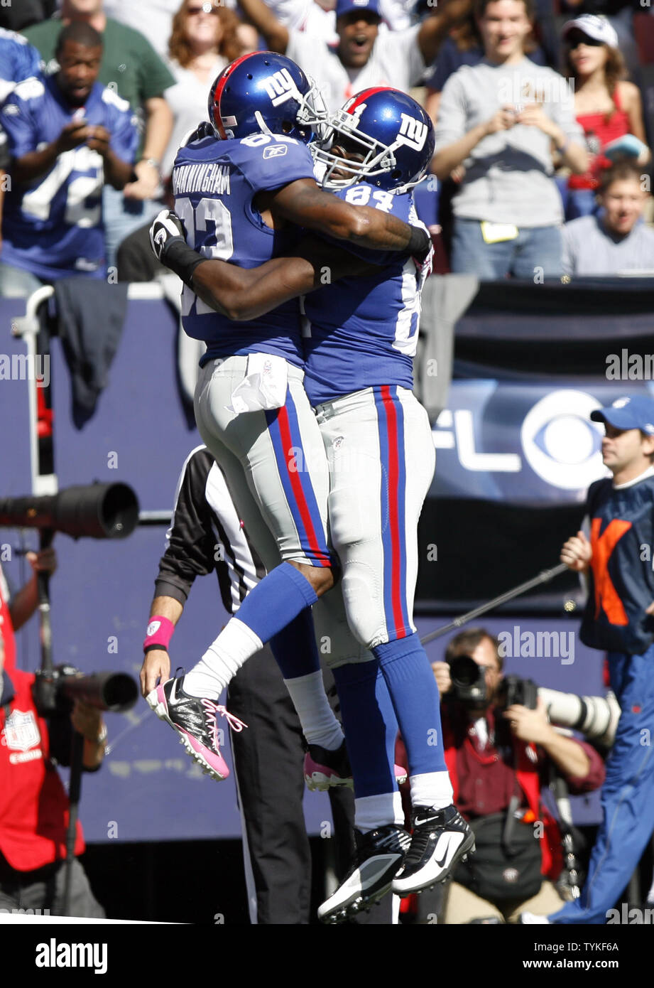 New York Giants Mario Manningham jumps into the arms of Darcy Johnson ...