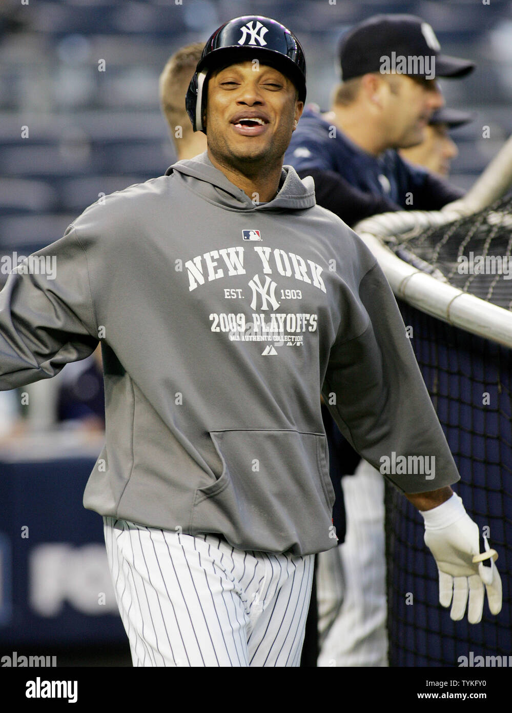 New York Yankees' Robinson Cano smiles as he warms up as the Yankees ...