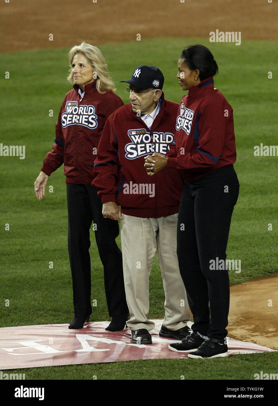 First lady Michelle Obama, Dr. Jill Biden and Yogi Bera wait for the ...