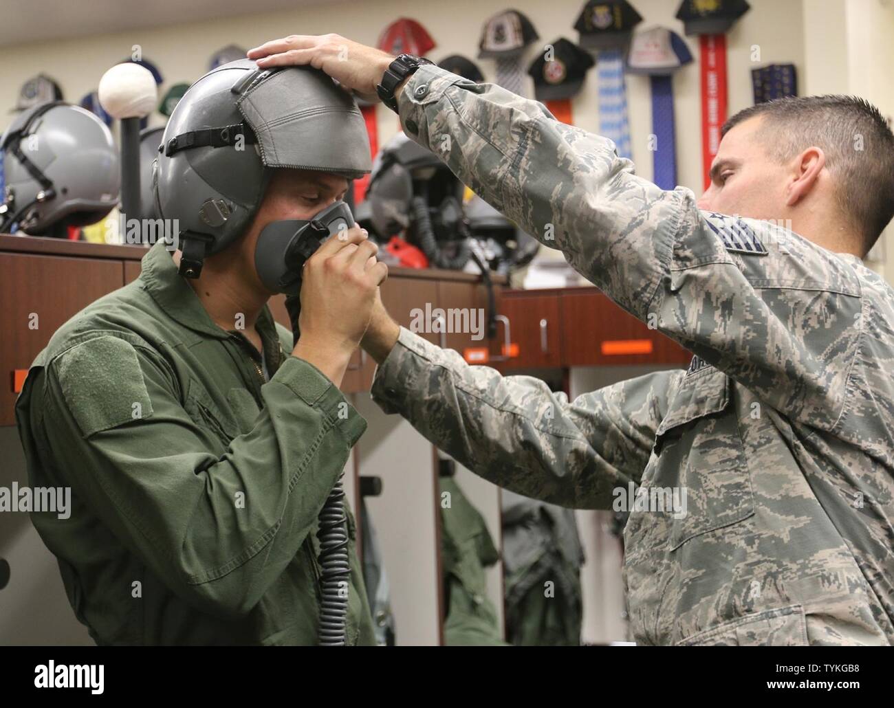 U.S. Marine Staff Sgt. (ret.) Charlie Linville is fitted with a helmet ...