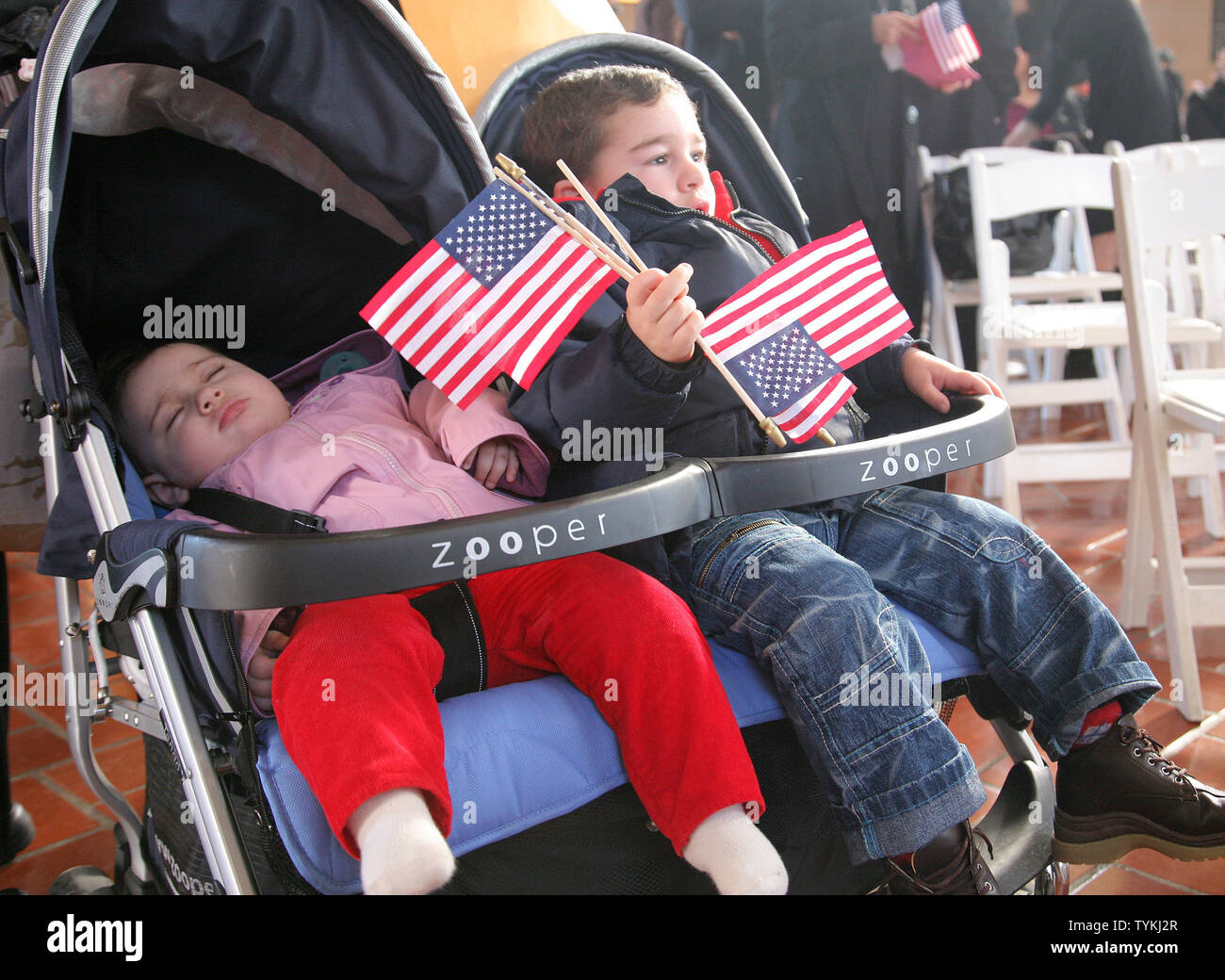 Yasmine Elwishahi, 9 months old, naps while her brother Yaser, 1 1/2 ...