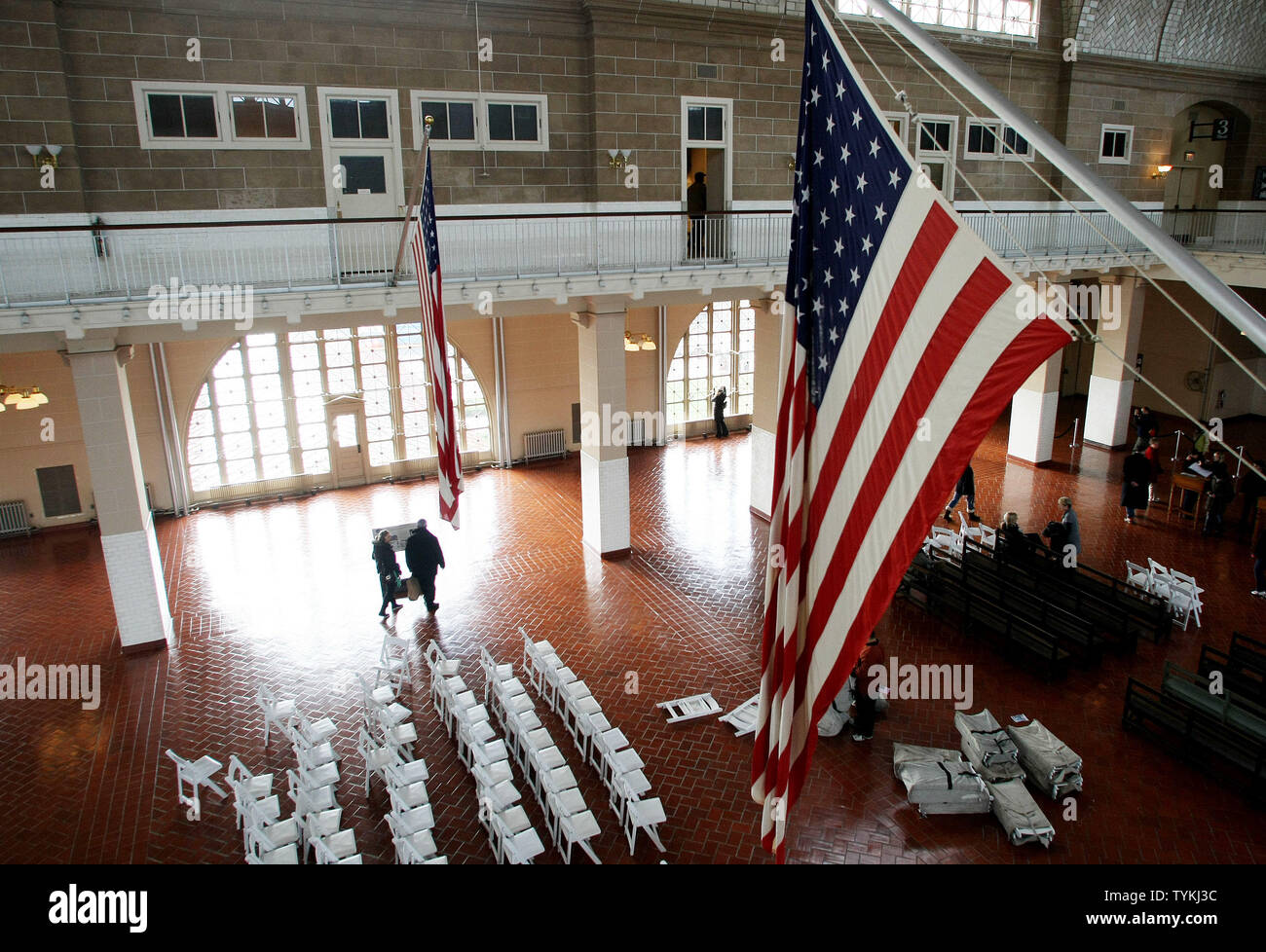 People visit the Great Hall on Ellis Island where immigrants were ...