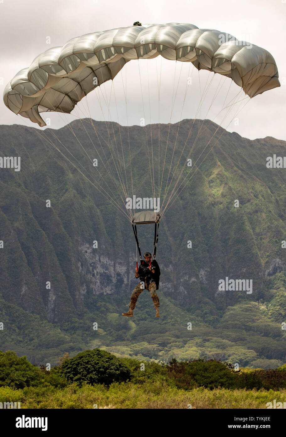 A U.S. Service member with Special Operation Command, Pacific, jumps ...