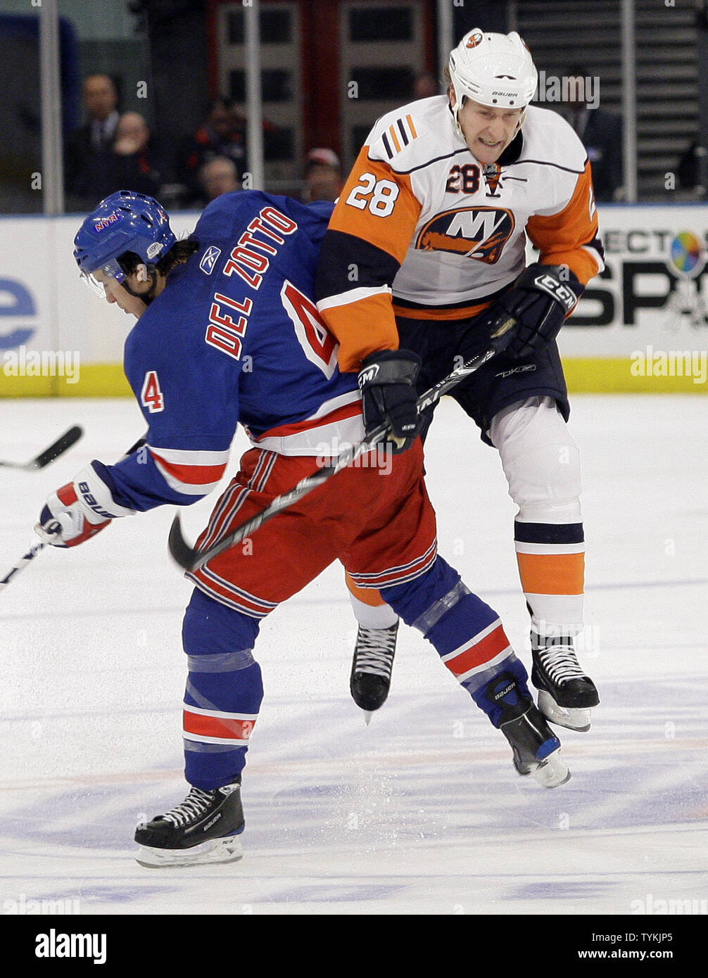 New York Islanders Tim Jackman (28) and New York Rangers Michael Del ...