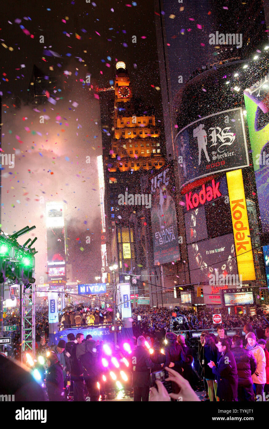Confetti rains over the crowds at the stroke of midnight as hundreds of ...