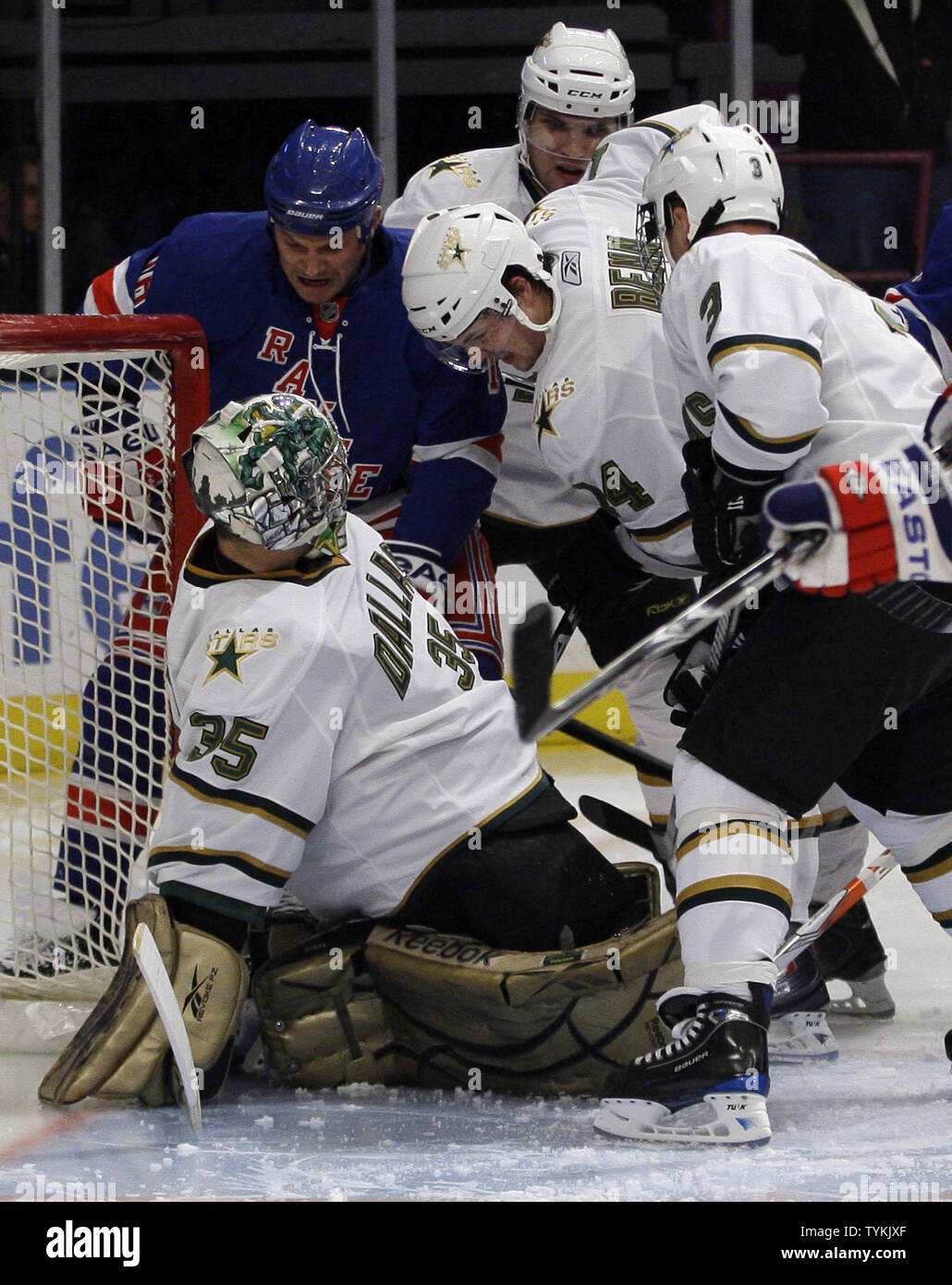 New York Rangers Sean Avery tries to get a puck past Dallas Stars Marty ...