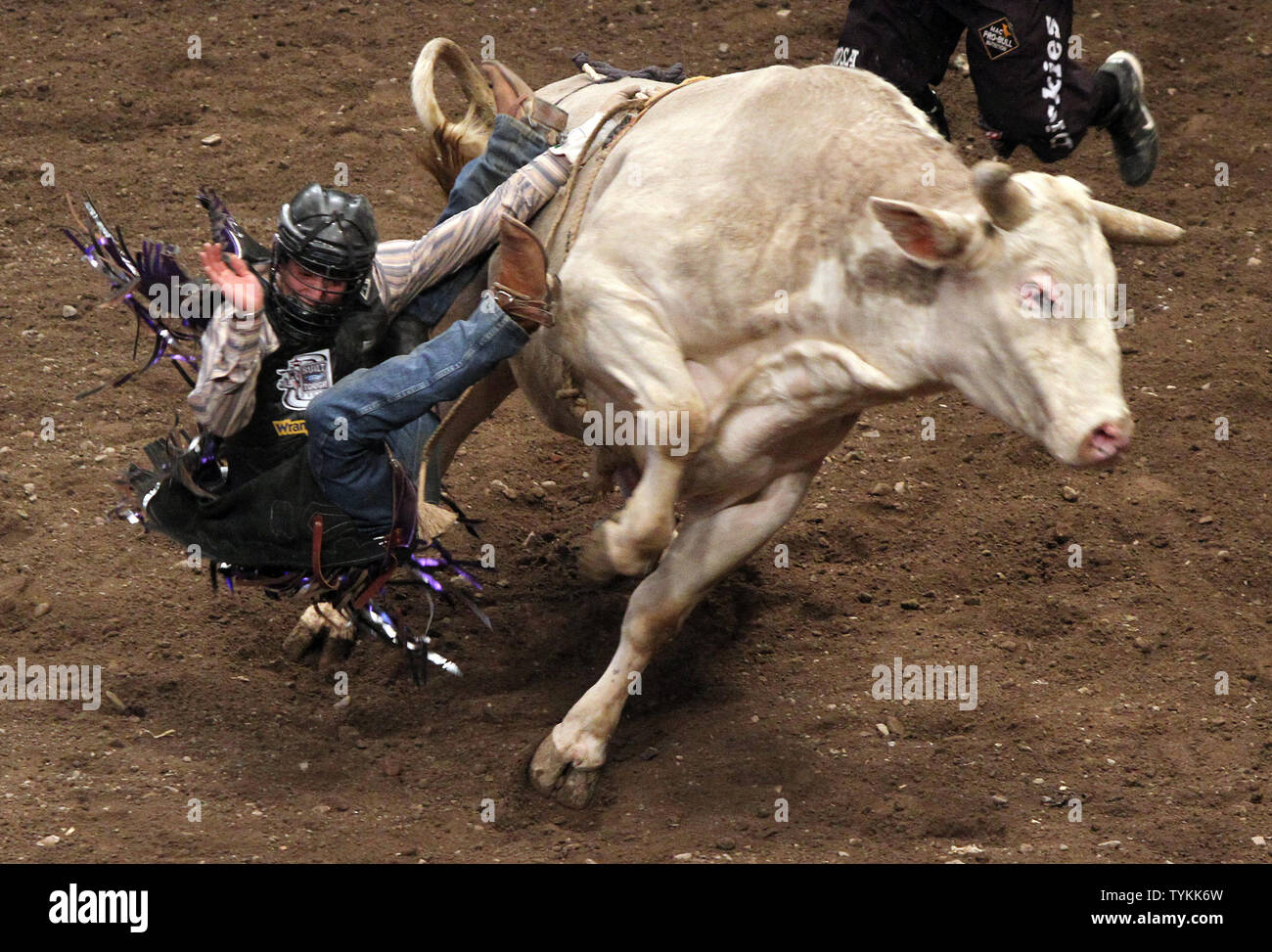 Bull riders compete at the Professional Bull Riders Championship at ...