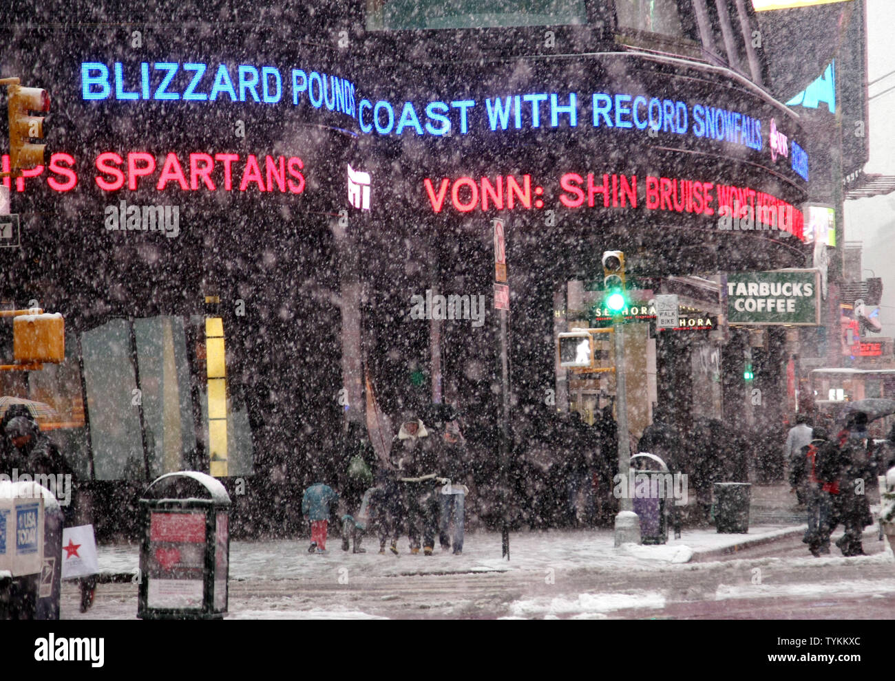 A news crawl is displayed in Times Square as a massive snow storm bears ...