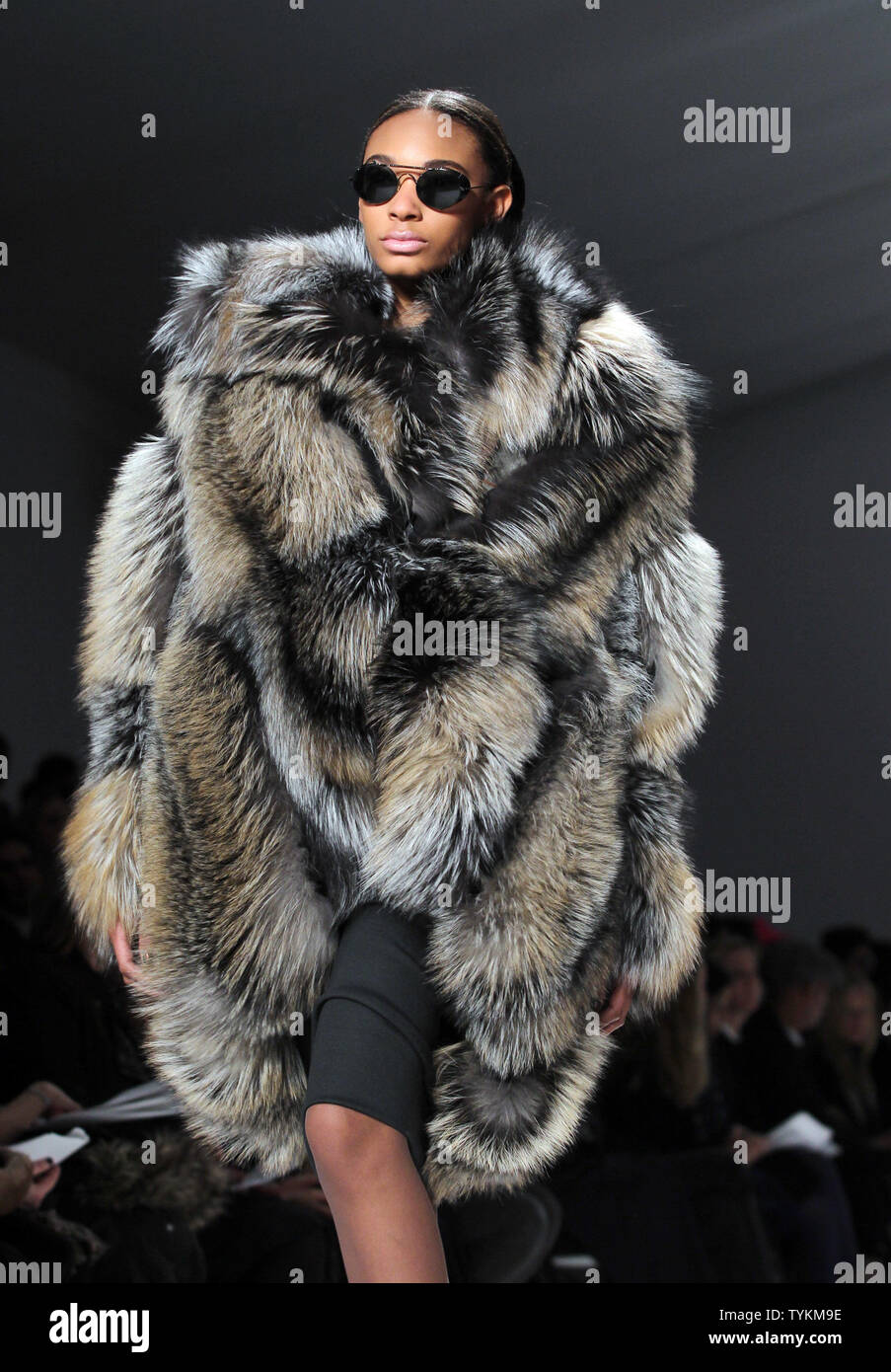 A model walks the runway at the Dennis Basso fall fashion show at ...
